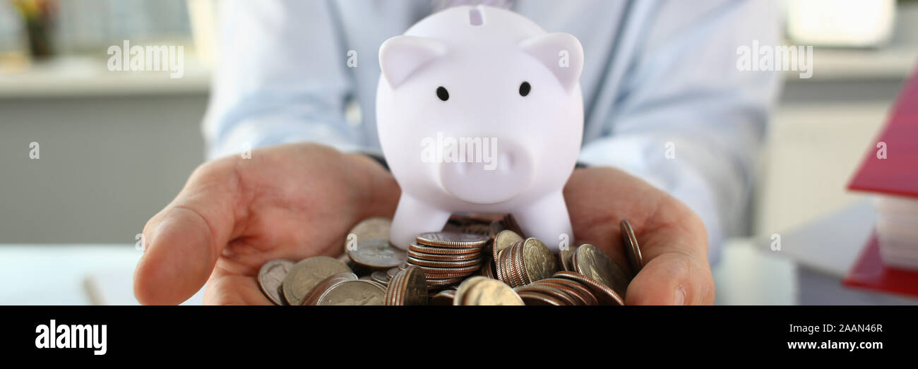 Hand businessman putting pin money Stock Photo - Alamy