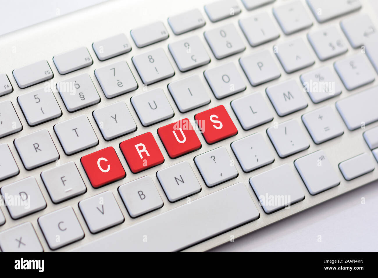 CRUS writing on white keyboard Stock Photo - Alamy