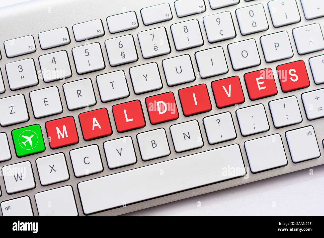 MALDIVES writing on white keyboard with a aircraft sketch Stock Photo ...