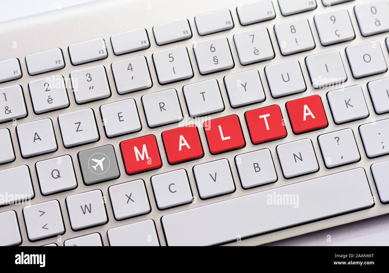 MALTA writing on white keyboard with a aircraft sketch Stock Photo - Alamy