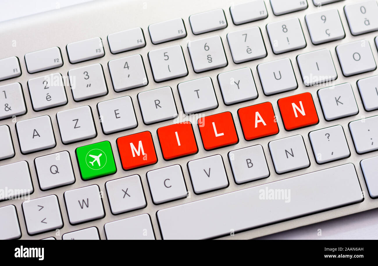 MILAN writing on white keyboard with a aircraft sketch Stock Photo - Alamy