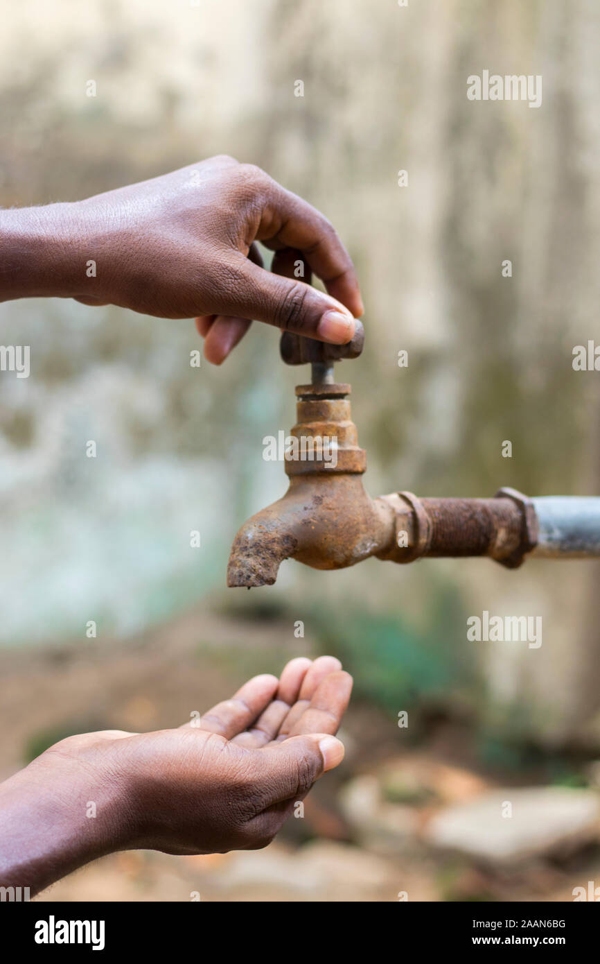 water crisis is a serious threat to India and worldwide,a man holding ...