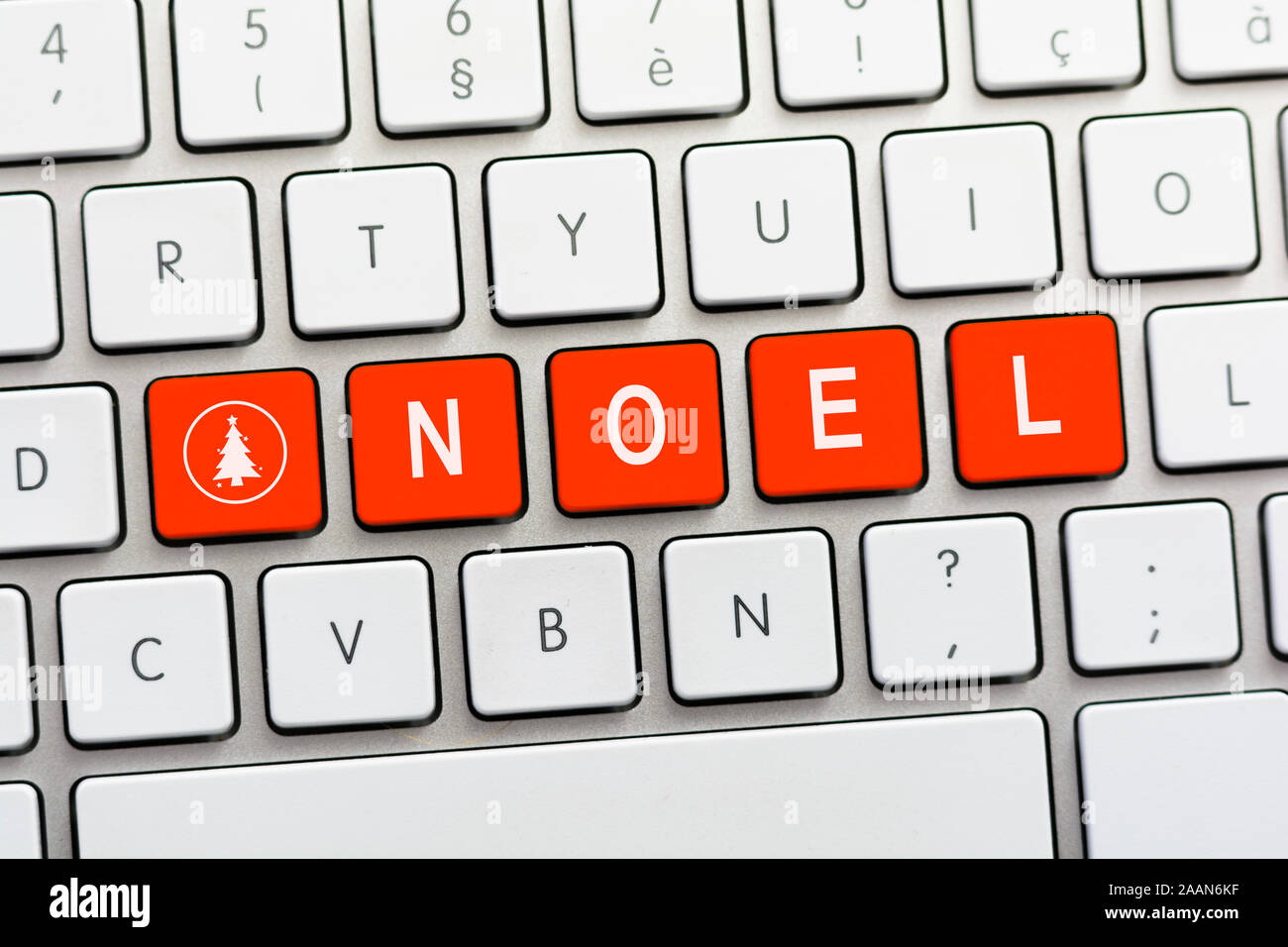 NOEL writing on white keyboard with a Xmas tree sketch Stock Photo - Alamy