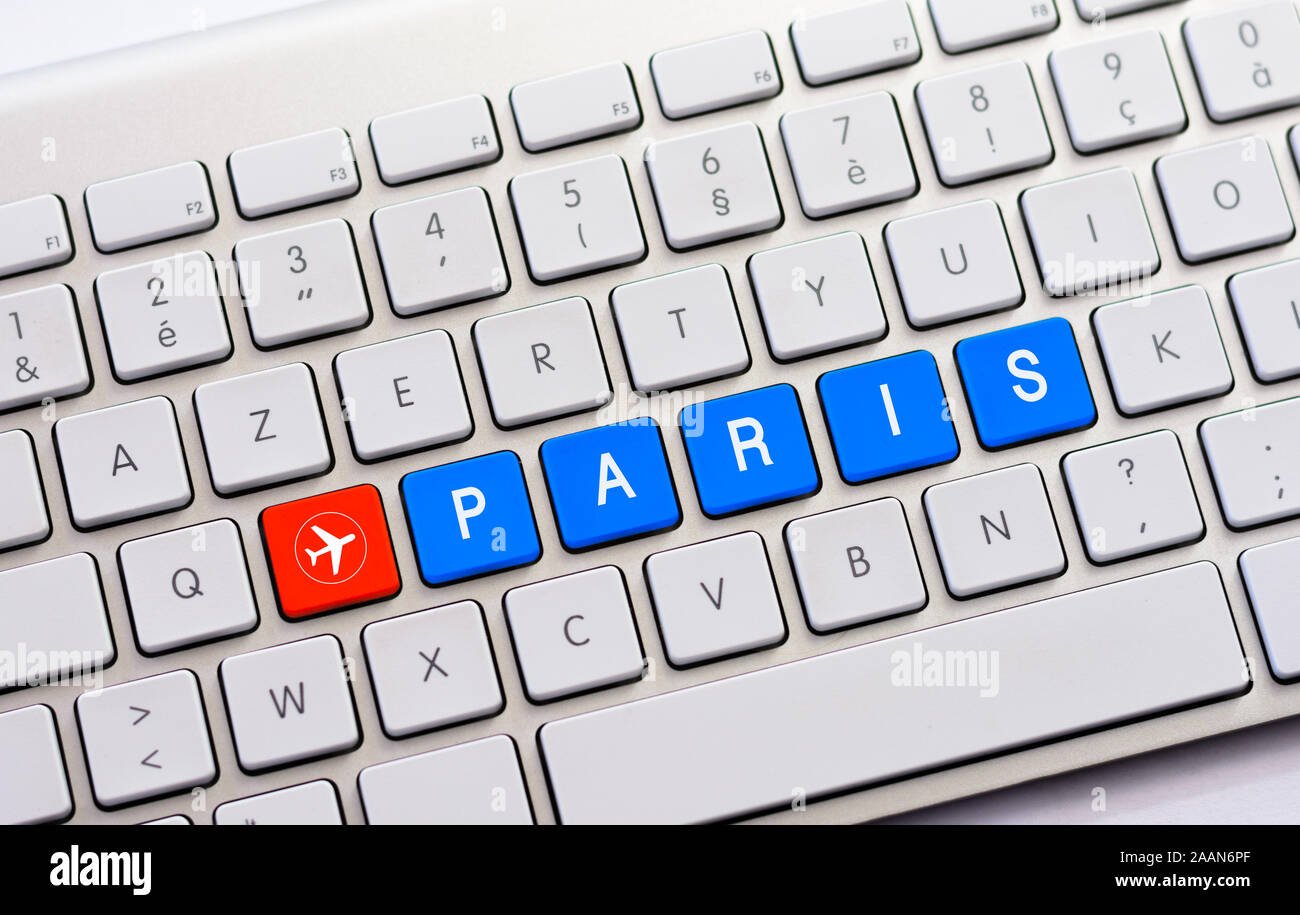 PARIS writing on white keyboard with a aircraft sketch Stock Photo - Alamy