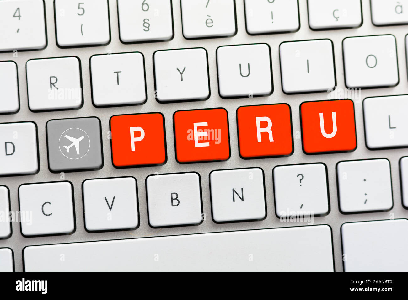 PERU writing on white keyboard with a aircraft sketch Stock Photo - Alamy