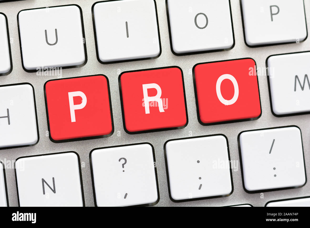 PRO writing on white keyboard Stock Photo - Alamy