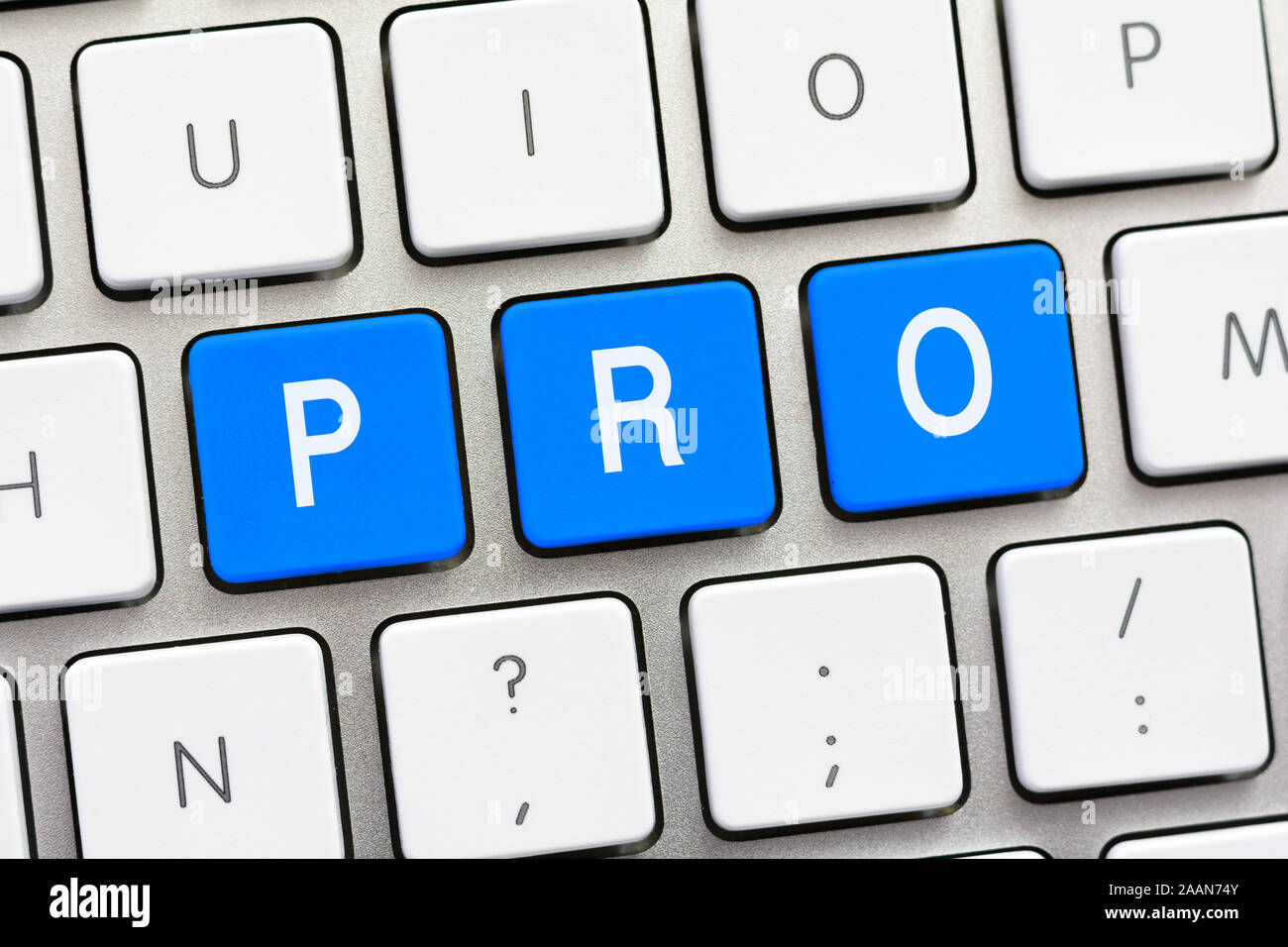 PRO writing on white keyboard Stock Photo - Alamy