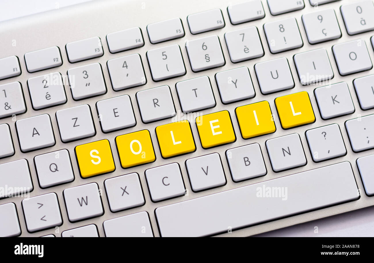 SOLEIL writing on white keyboard Stock Photo - Alamy