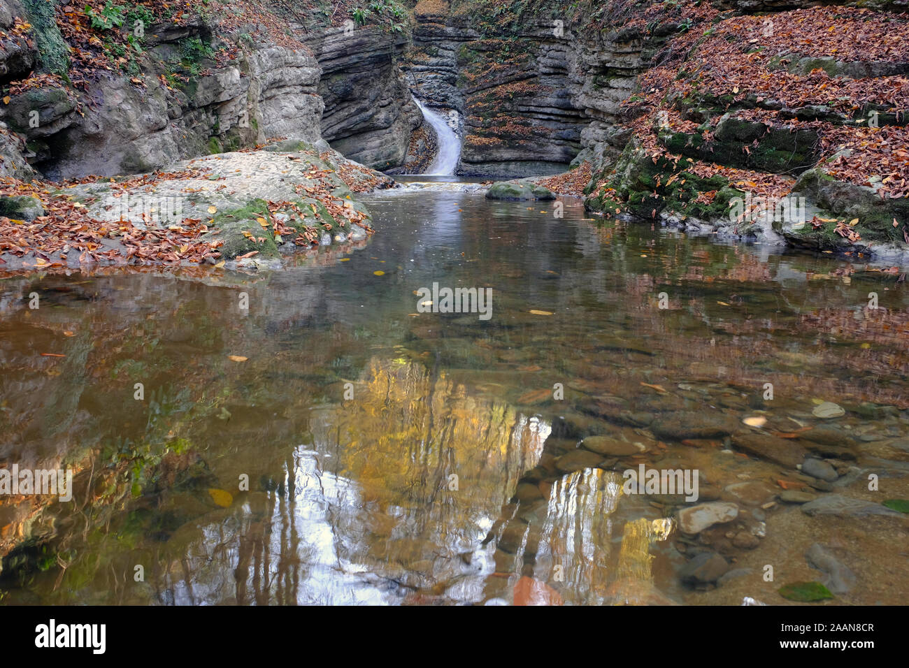 a waterfall and interesting rock formation in autumn in iskenderli ...