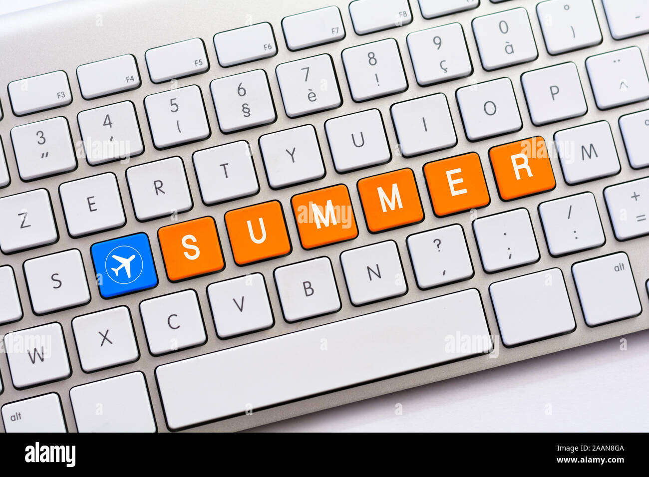 SUMMER writing on white keyboard with a aircraft sketch Stock Photo - Alamy