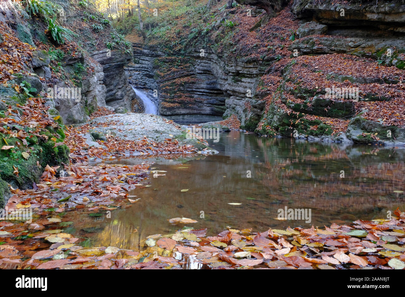 a waterfall and interesting rock formation in autumn in iskenderli ...