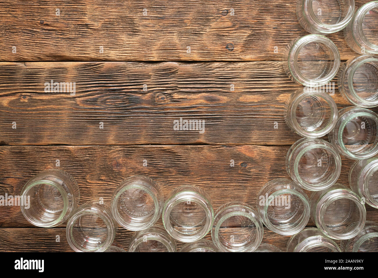 Empty glass jars from baby food on the wooden table flat lay background ...