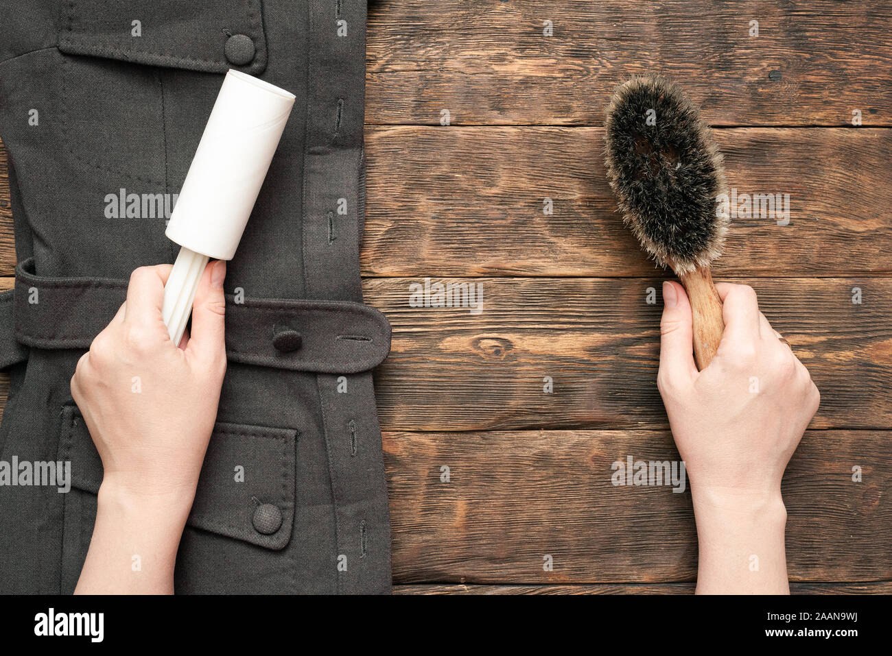Woman cleans clothes with a cleaning roller and brush close up Stock ...