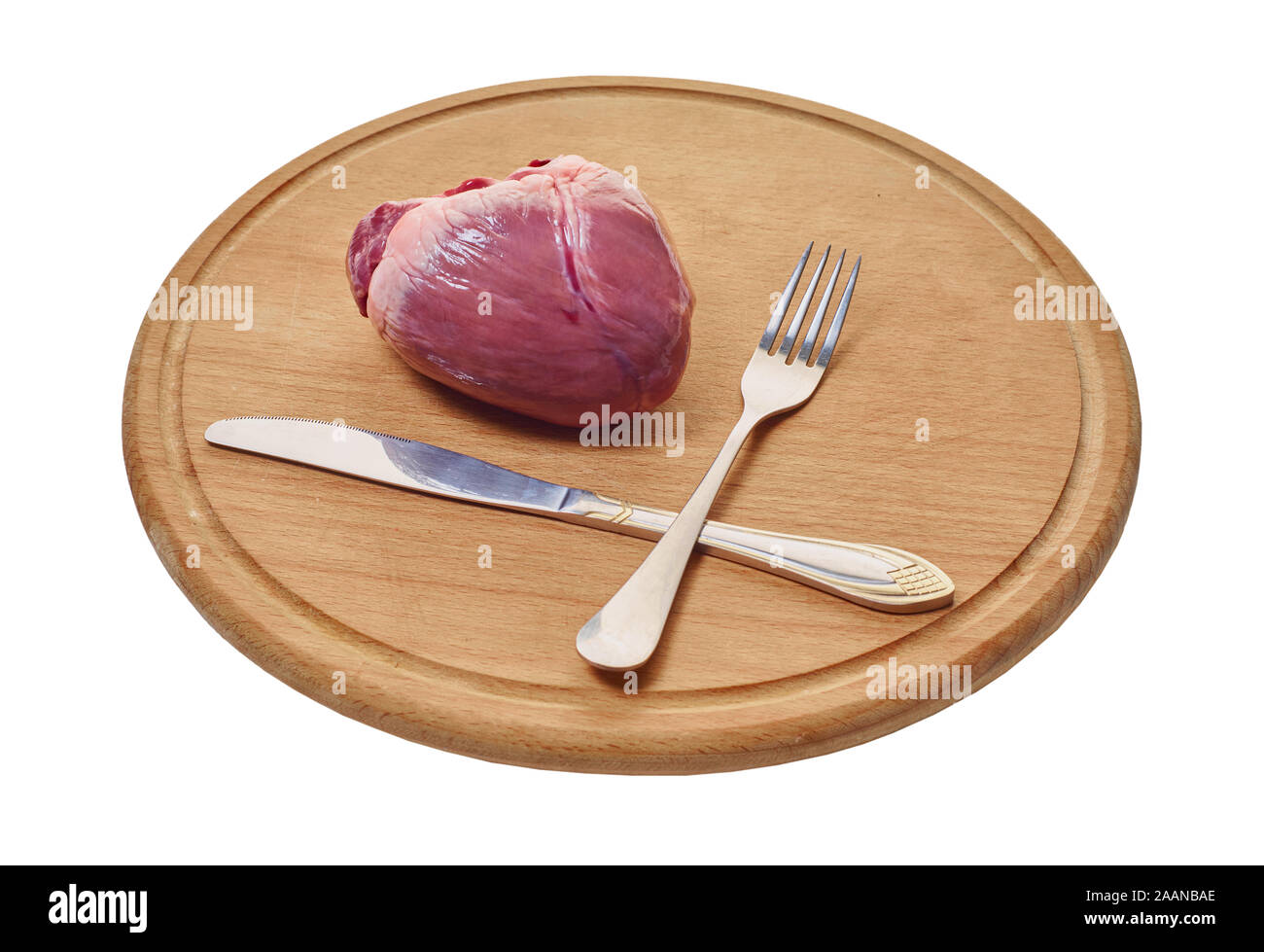 raw heart on a board with cutlery, white isolated background Stock ...