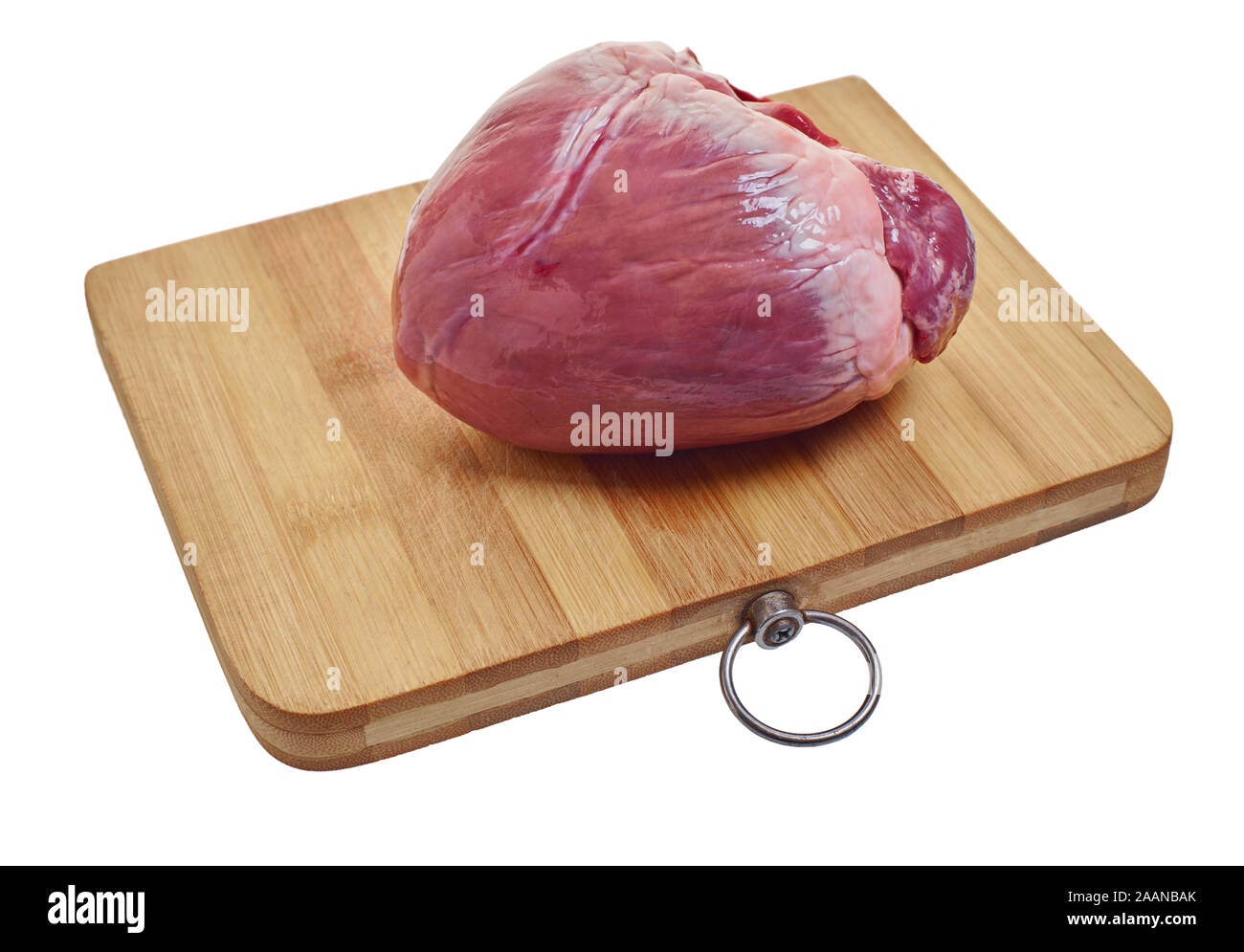 raw heart on a cutting board, white isolated background Stock Photo - Alamy