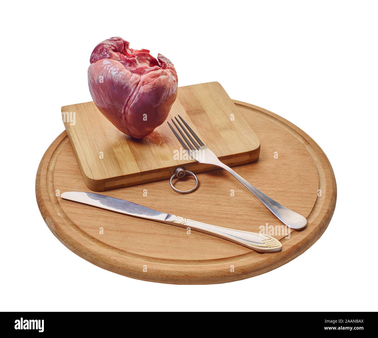 raw heart on a board with cutlery, white isolated background Stock ...