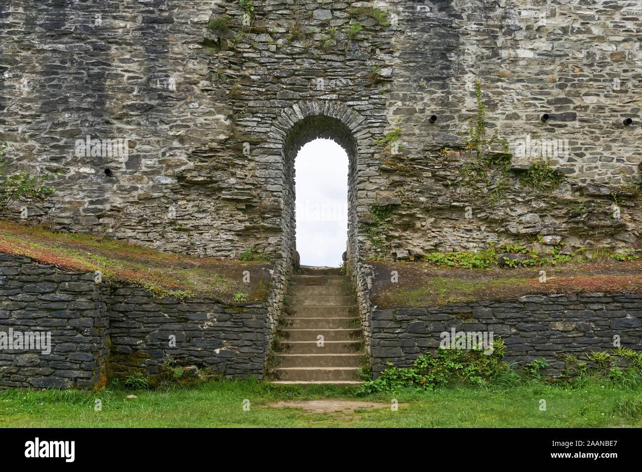 Arch with stairway in large brick wall of old medieval castle Stock ...