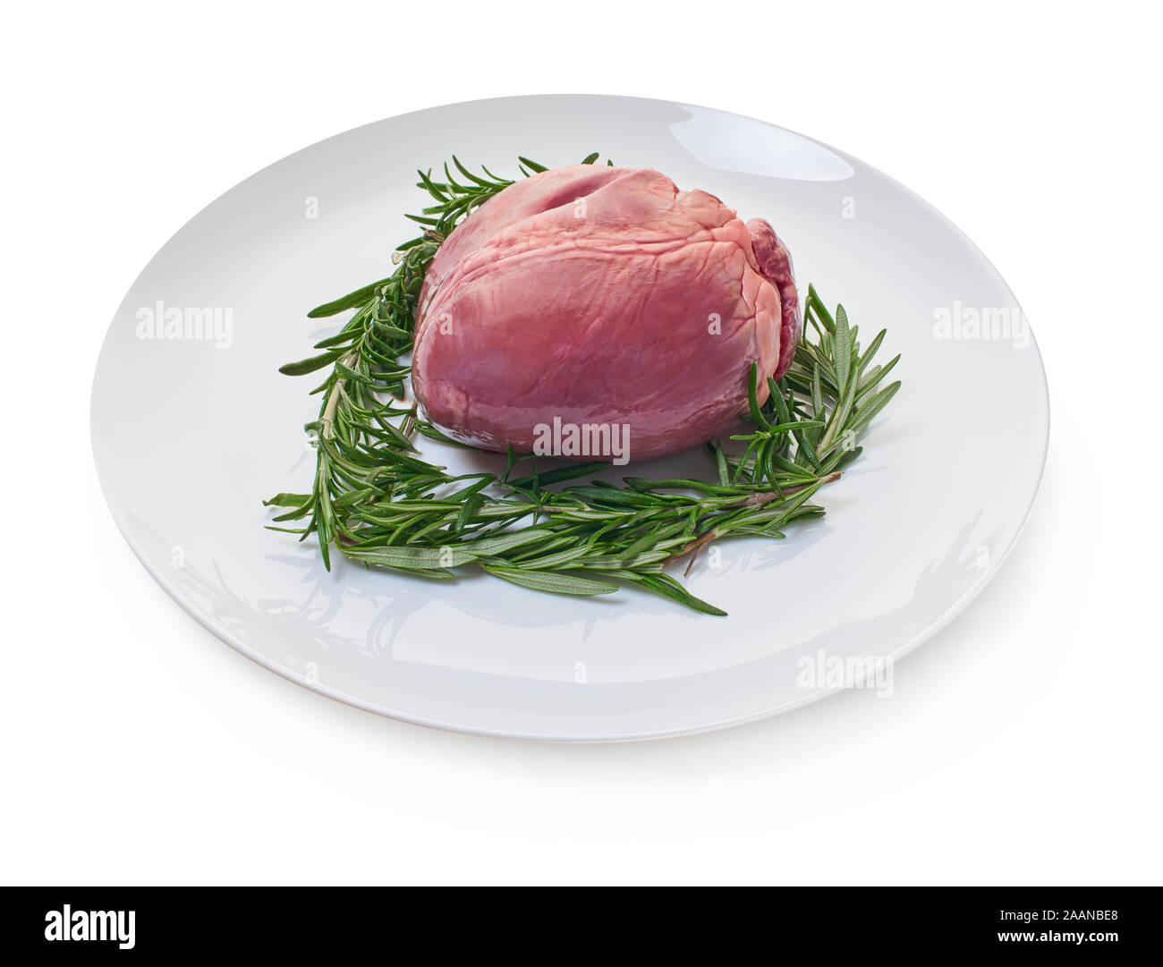 raw meat, beef heart with rosemary, white isolated background Stock ...