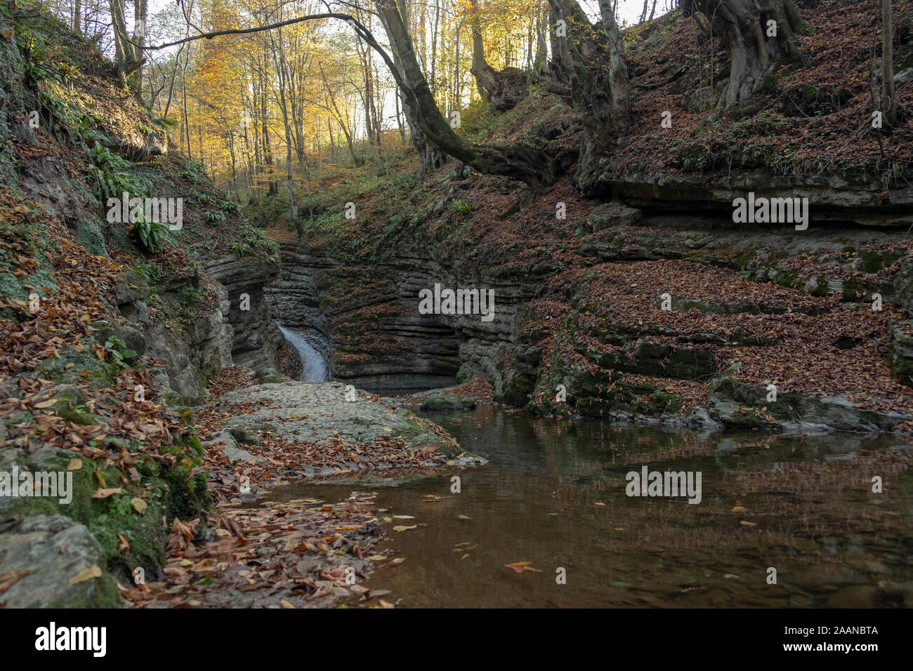 a waterfall and interesting rock formation in autumn in iskenderli ...
