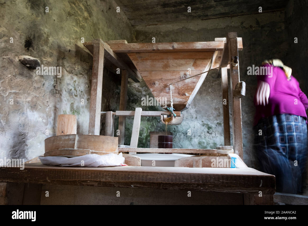 old woman grinding corn in an old water mill in tonya trabzon Stock ...