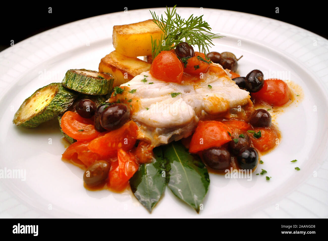 Italian food recipes monkfish with tomato, olives, capers (livornese ...