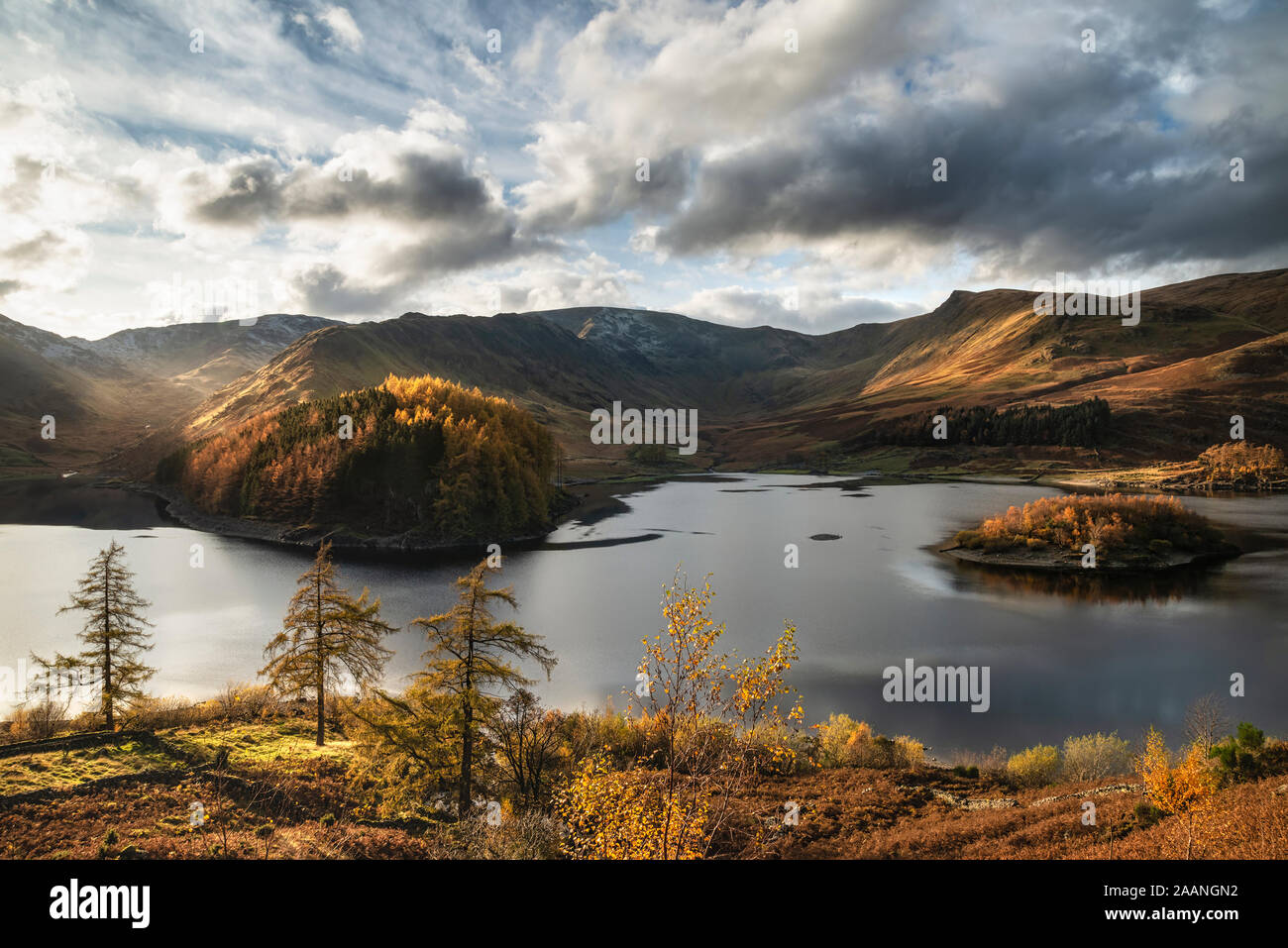 Epic Autumn Fall landscape of Hawes Water with epic lighting and ...