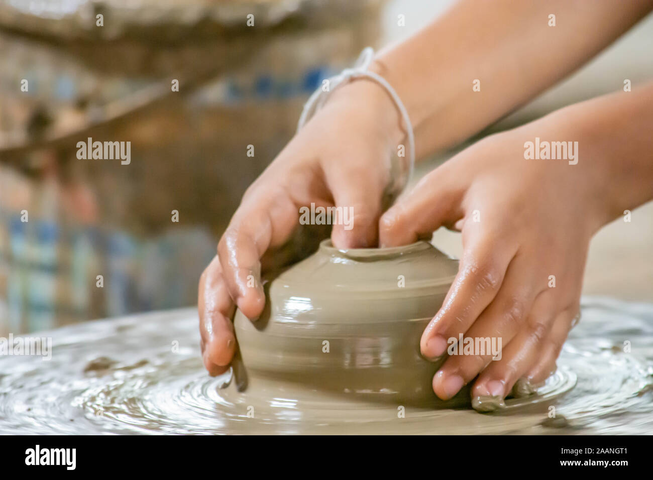 The fingers are shaped clay pot on a rotating tray Stock Photo - Alamy