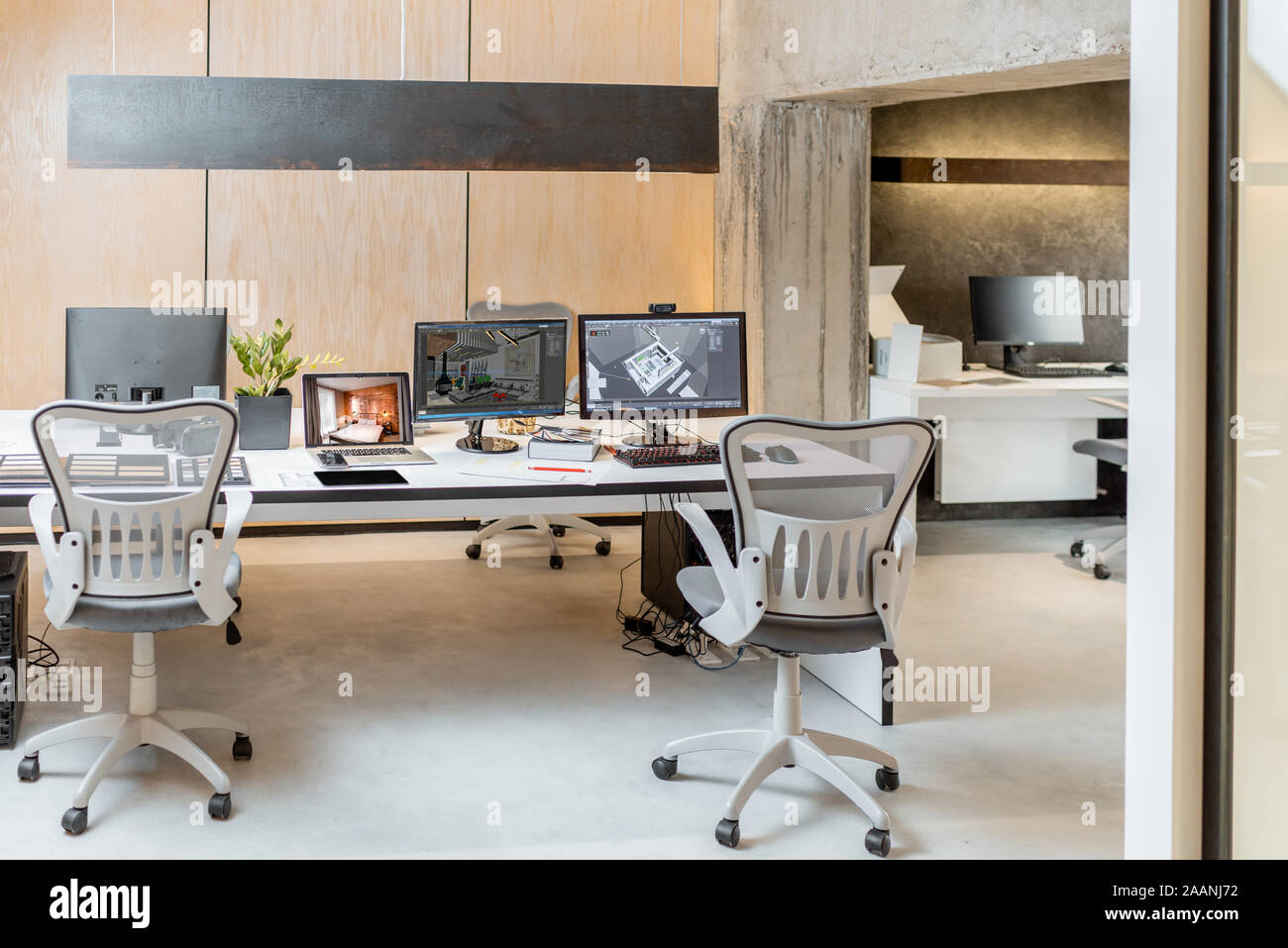 Creative workplace of designers or architects with computers in the ...