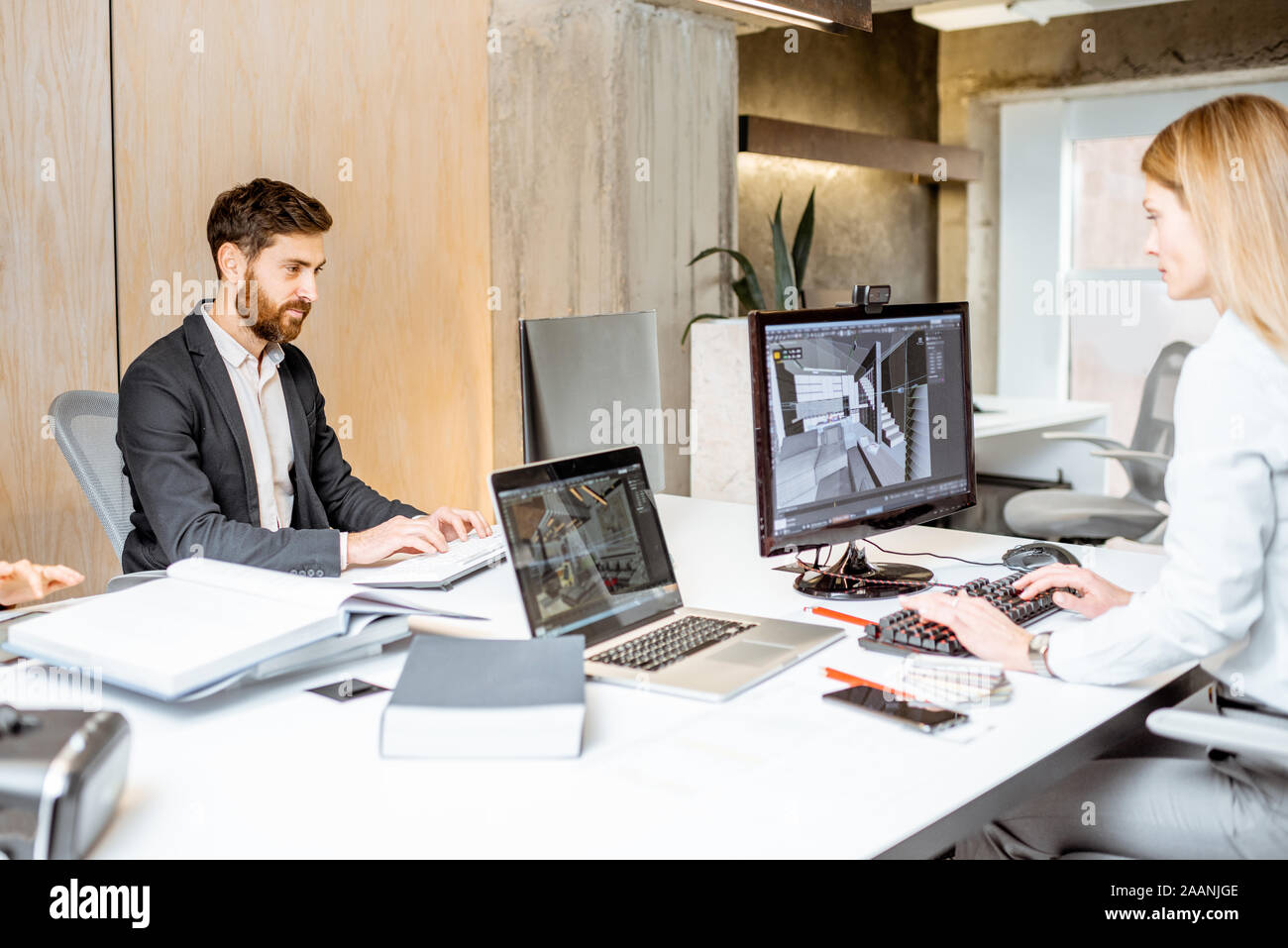 Creative office employees making interior design on the computers ...