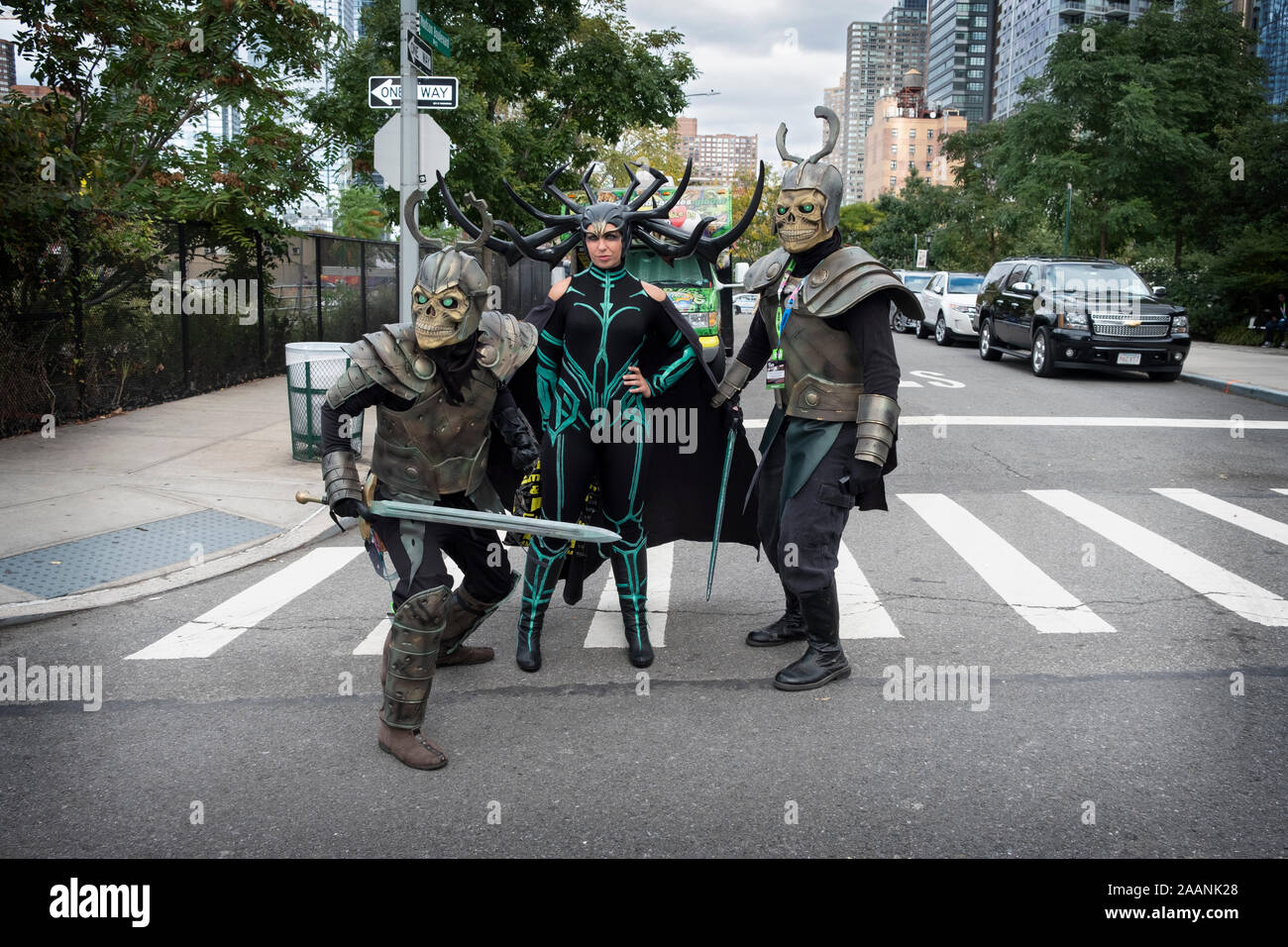 Two men and a woman pose as characters from Thor Ragnarok, a superhero ...