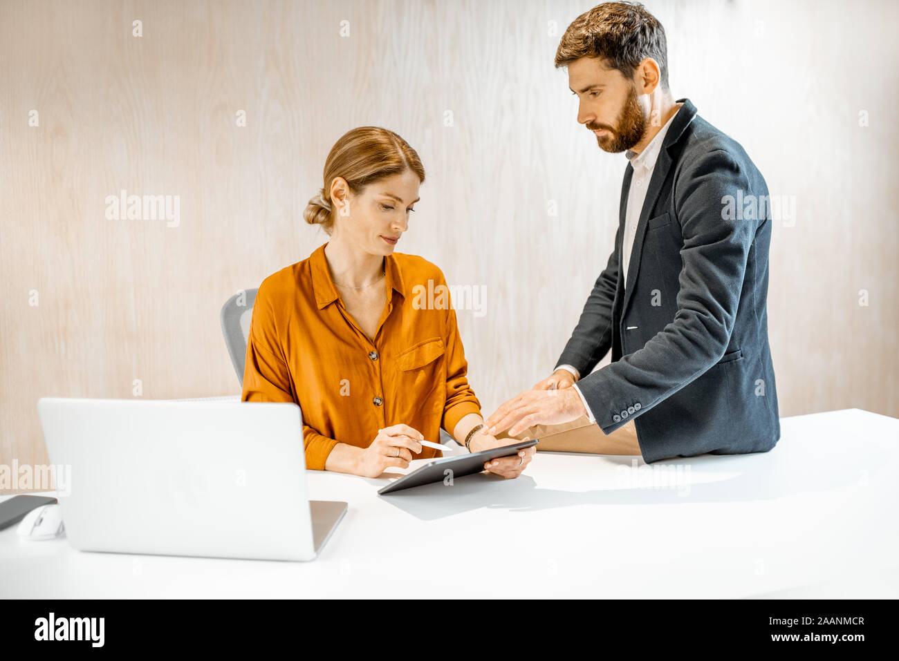 Businessman having some informal conversation with work colleague or ...