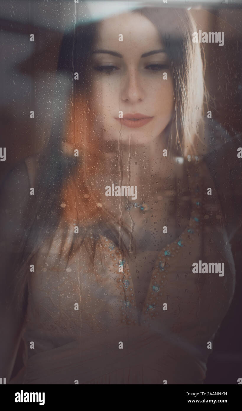 Portrait beautiful woman behind window hi-res stock photography and ...