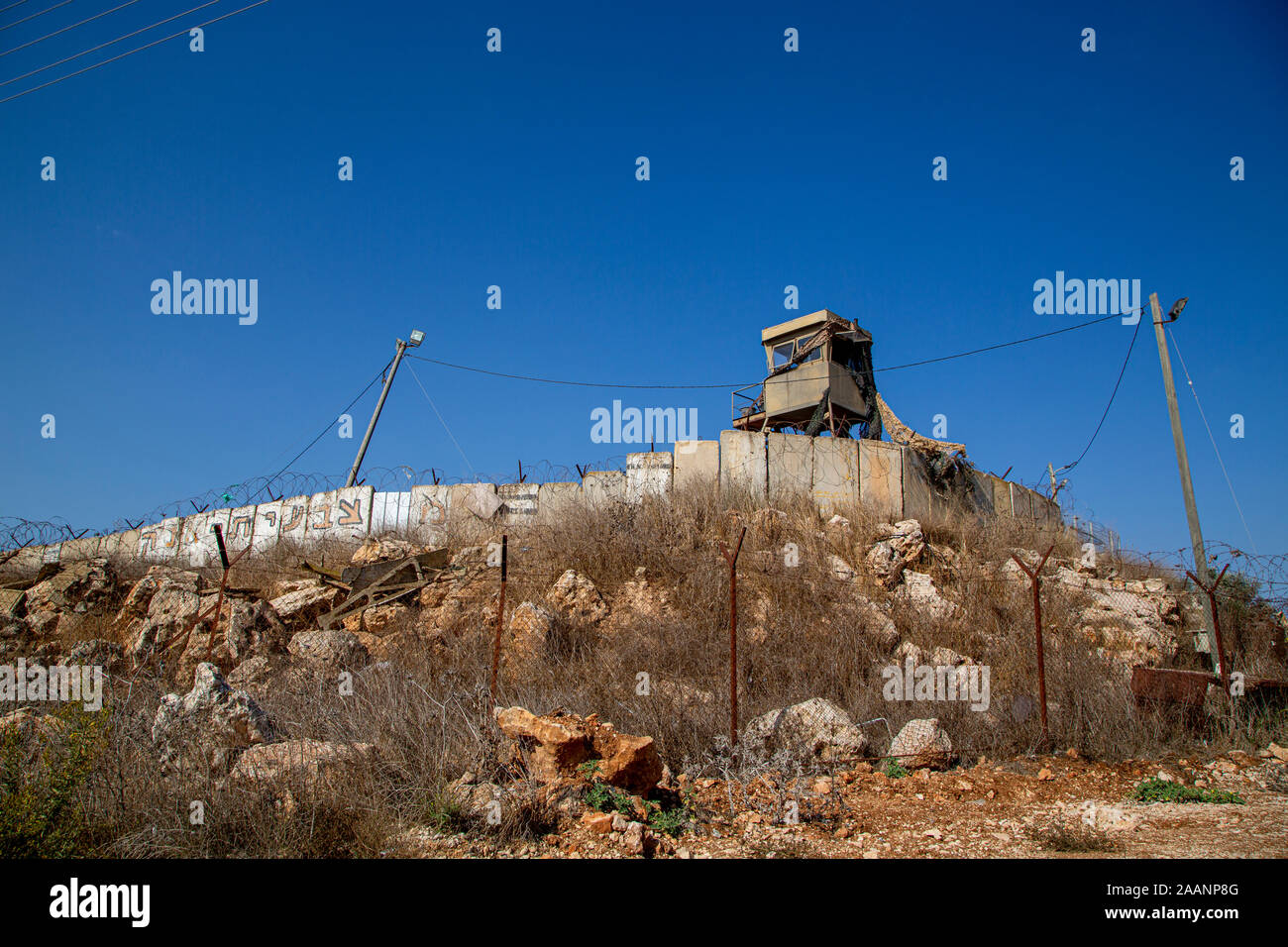 A military watch tower on a border wall separating Israeli settlements ...