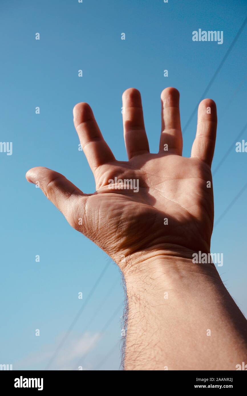 raised hand feeling freedom, hand up Stock Photo - Alamy