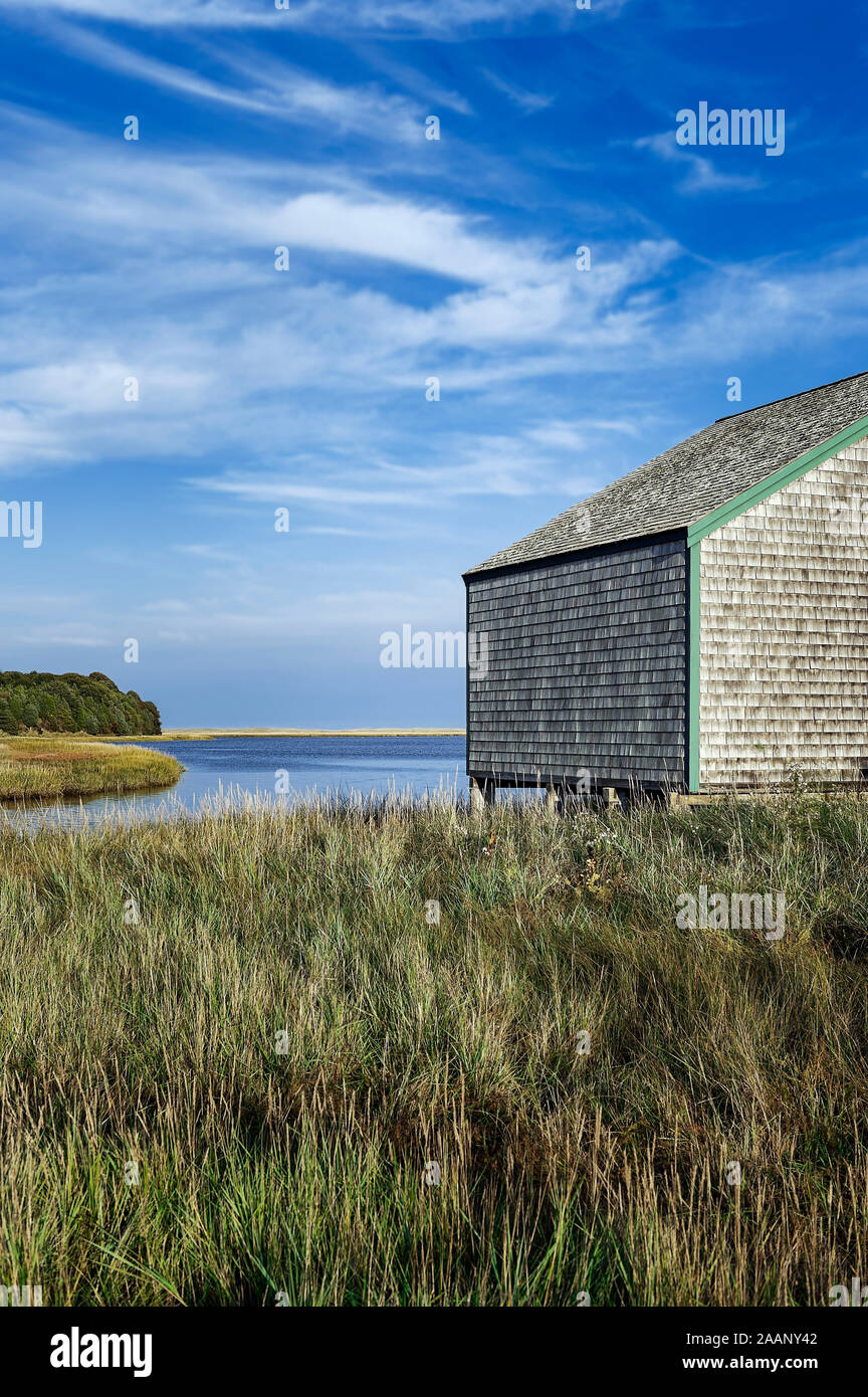 Nauset Marsh salt pond and rustic boathouse leading out to Cape Cod ...