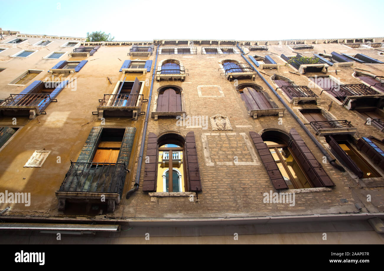 Charming brick exterior and windows of old Italian buildings in ...