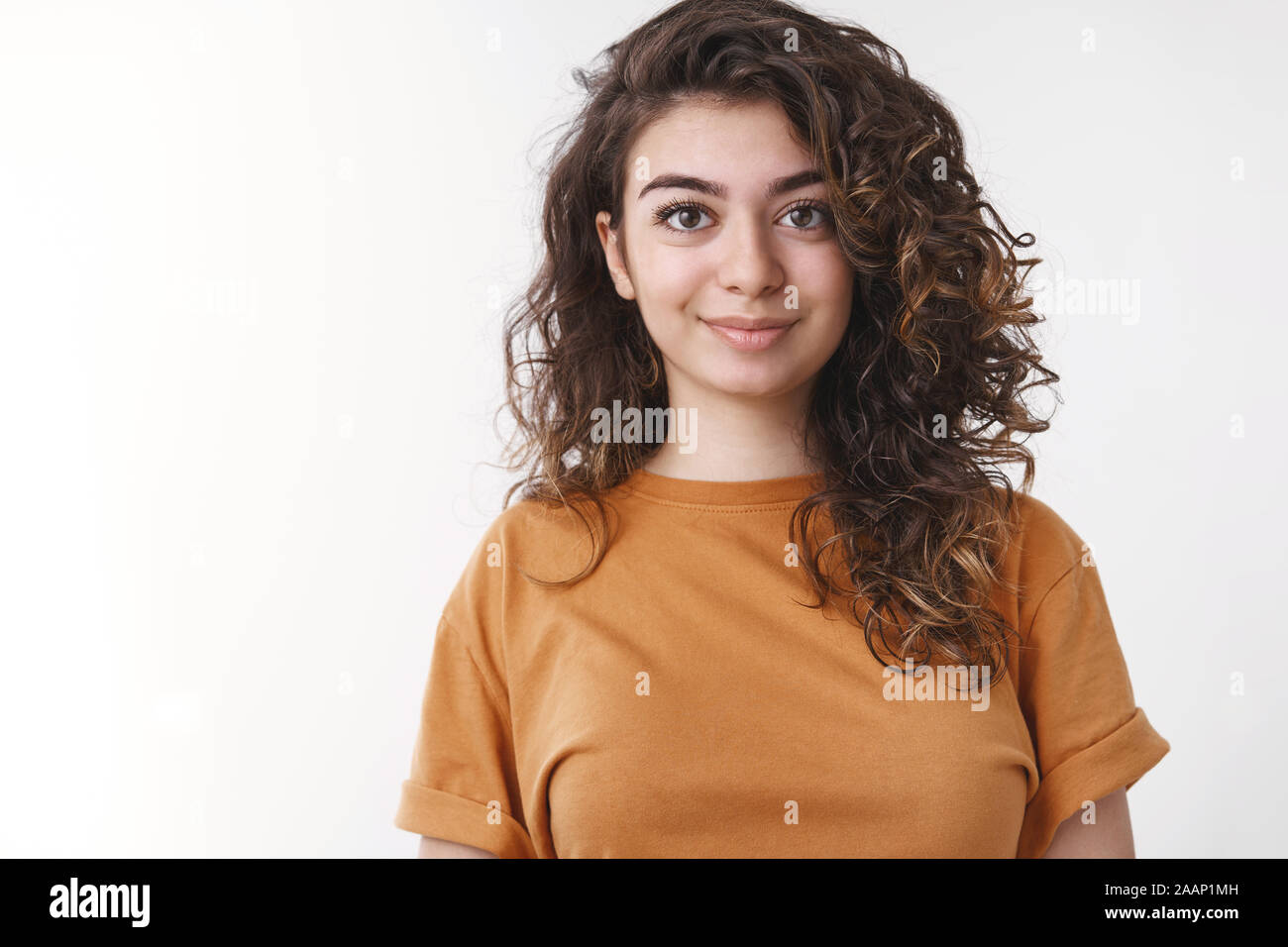Waist-up attractive friendly-looking smiling curly-haired armenian 20s ...