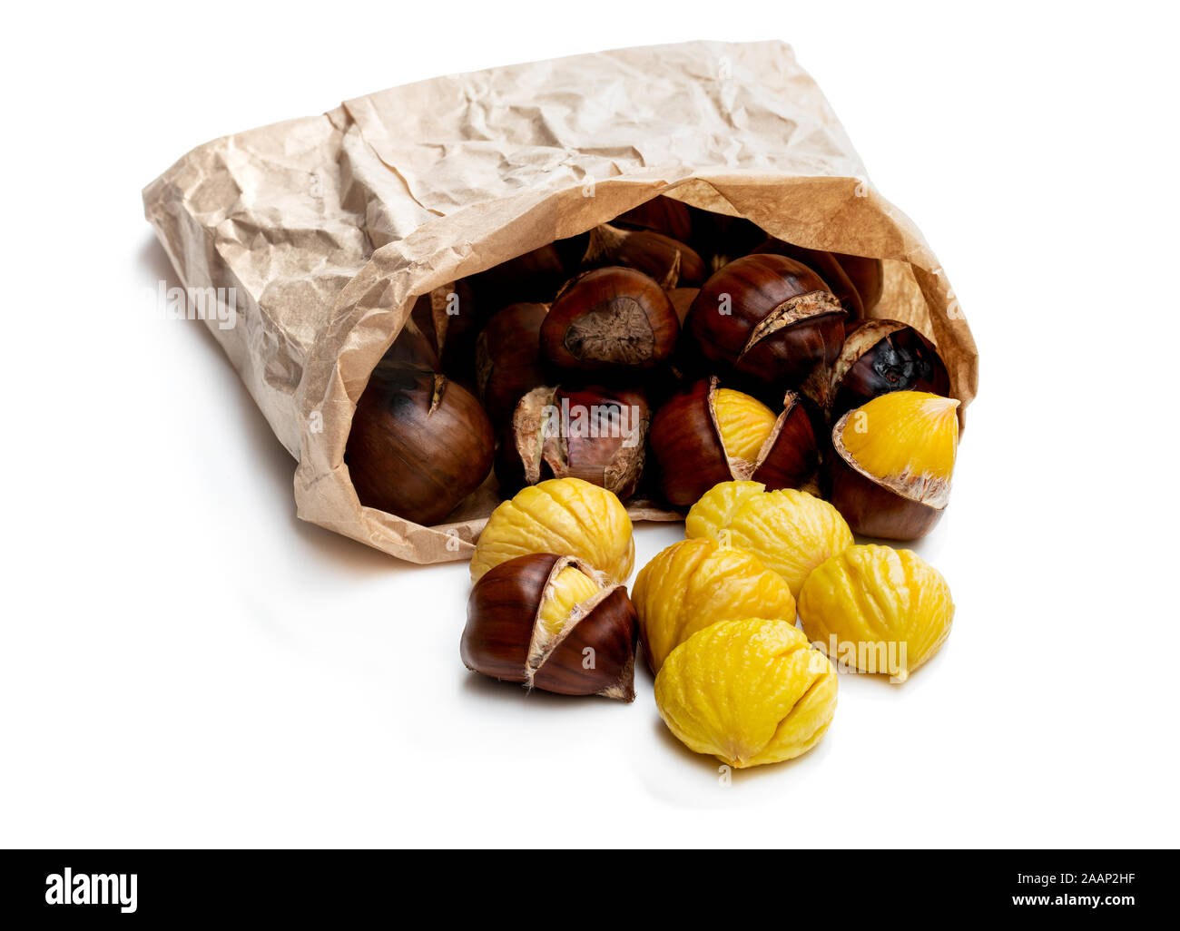 Roasted chestnut scattered of the paper bag isolated on white Stock ...