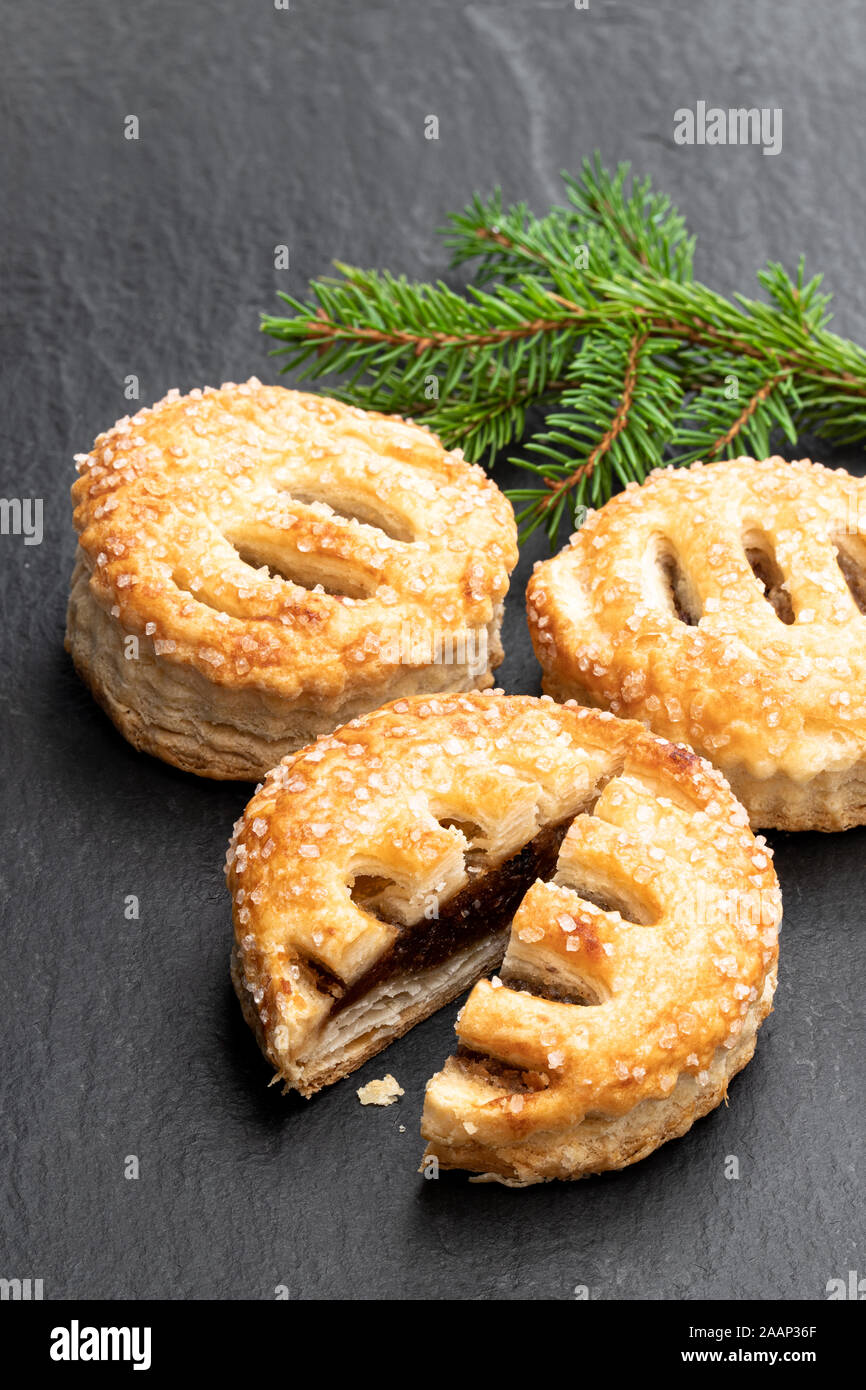 Christmas butter mince pies on black stone background. Top view Stock ...