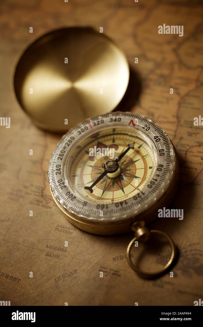 Vintage compass and old navigation map Stock Photo - Alamy
