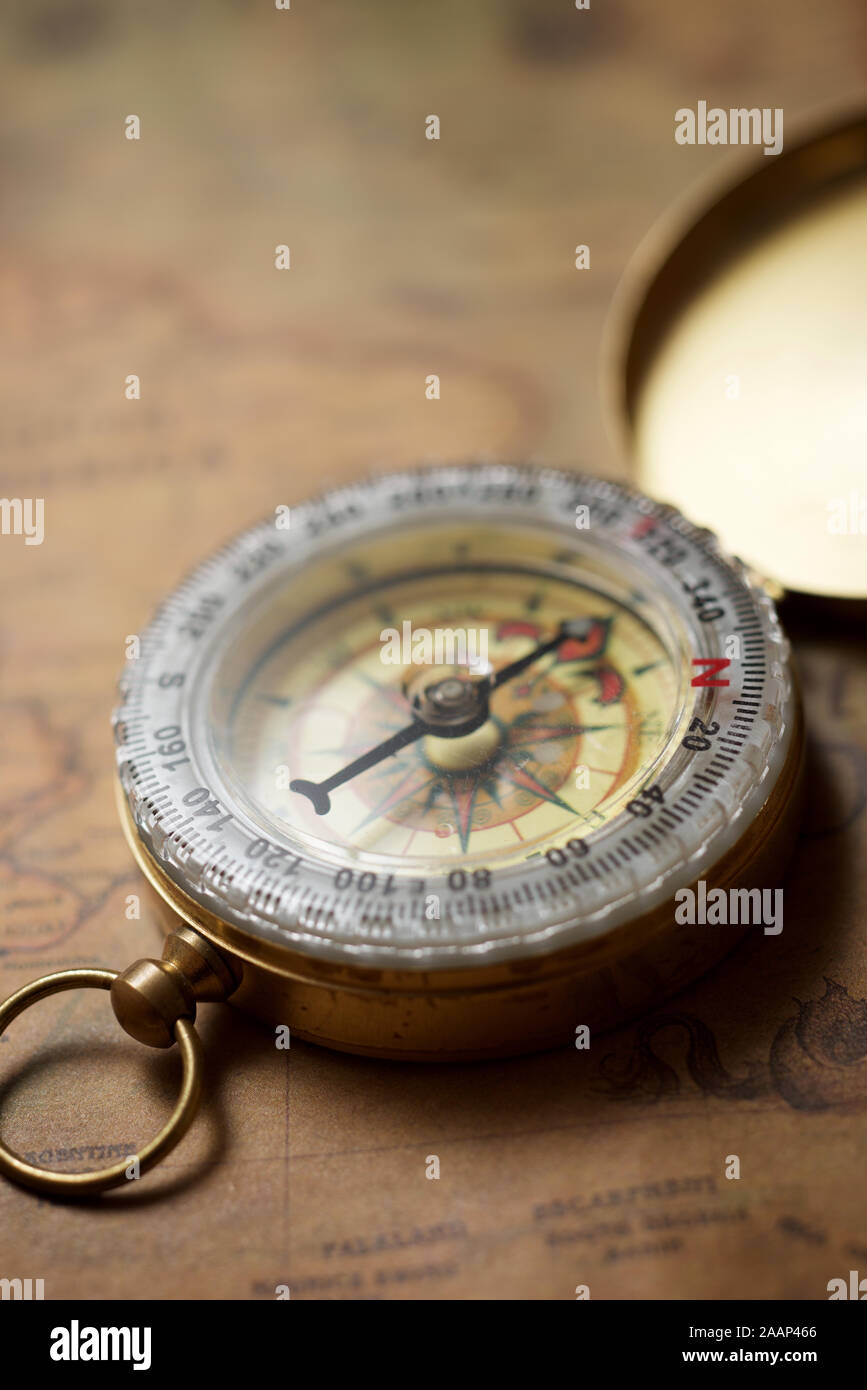Vintage compass and old navigation map Stock Photo - Alamy