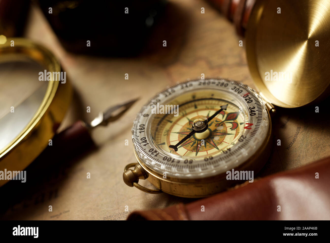 Vintage compass and old navigation map Stock Photo - Alamy