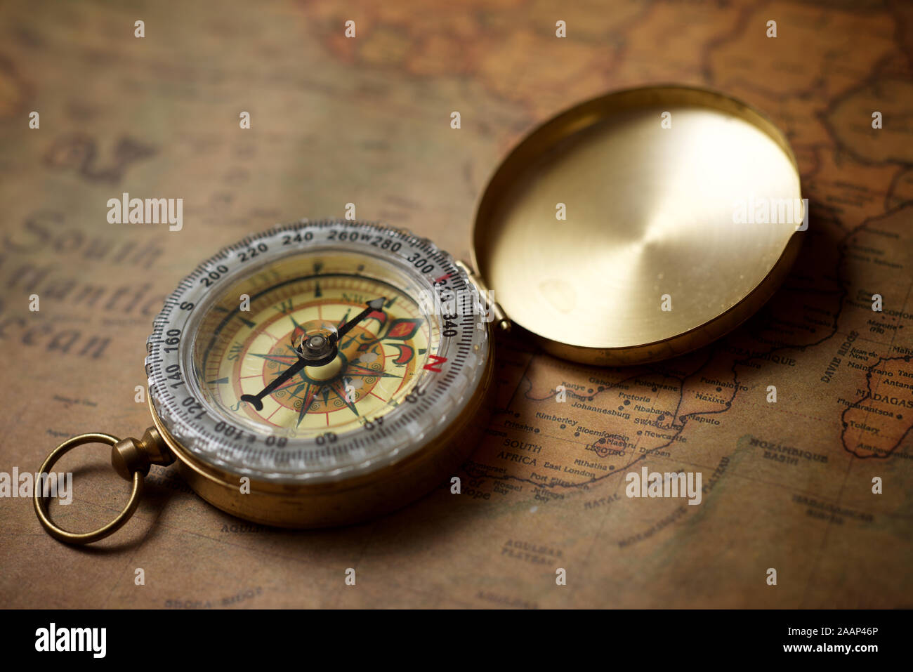 Vintage compass and old navigation map Stock Photo - Alamy