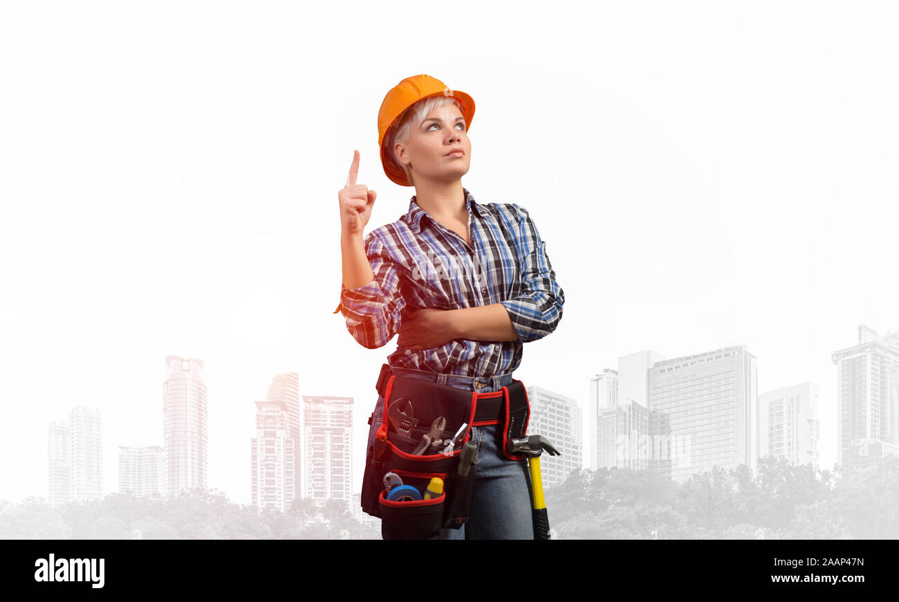 Beautiful female builder in hardhat Stock Photo - Alamy