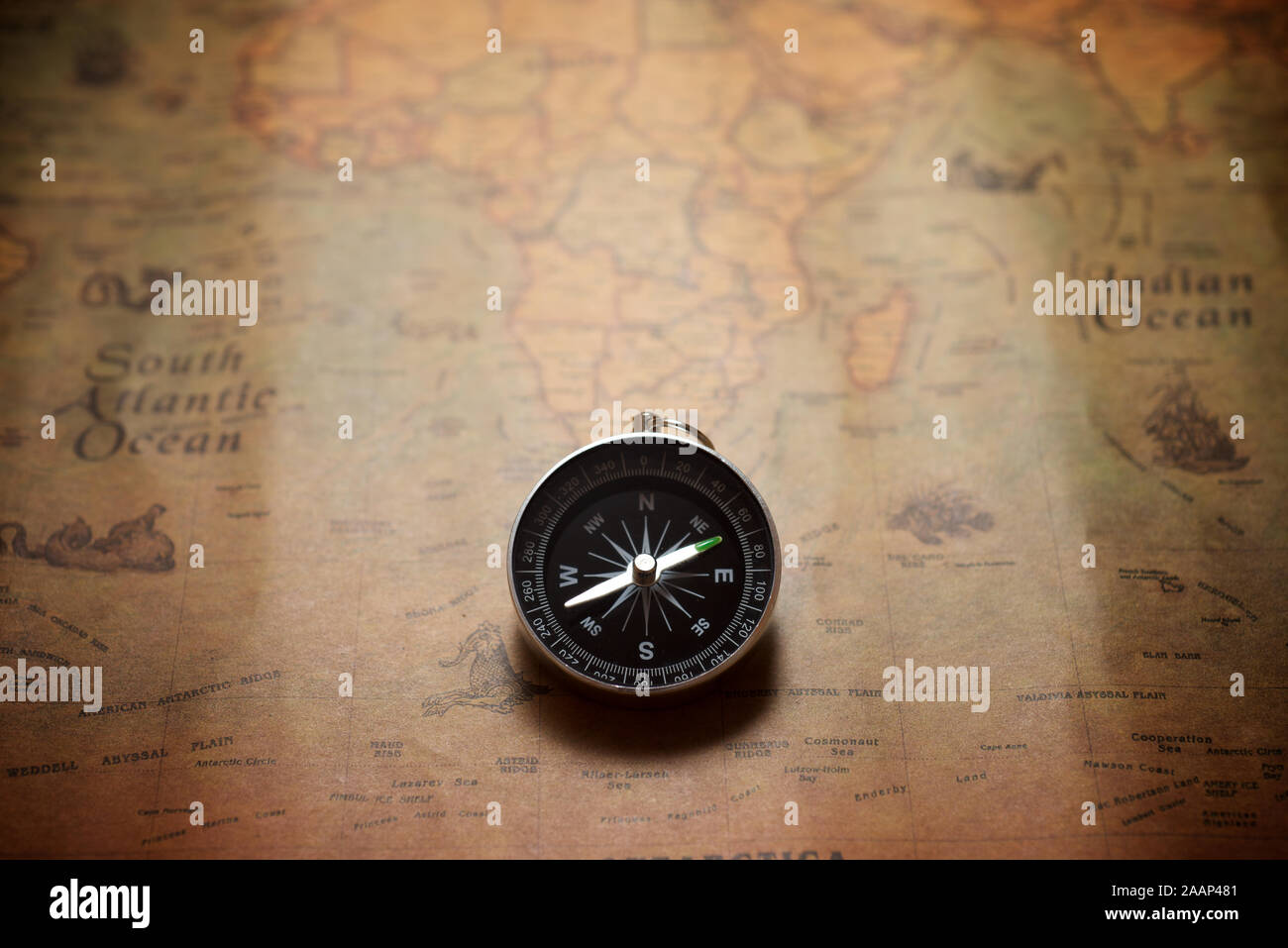 Vintage compass and old navigation map Stock Photo - Alamy