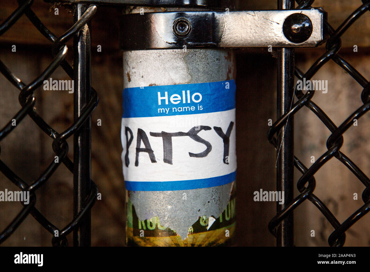 A visitor sticker with the text "Hello, My name is Patsy" on the wooden ...