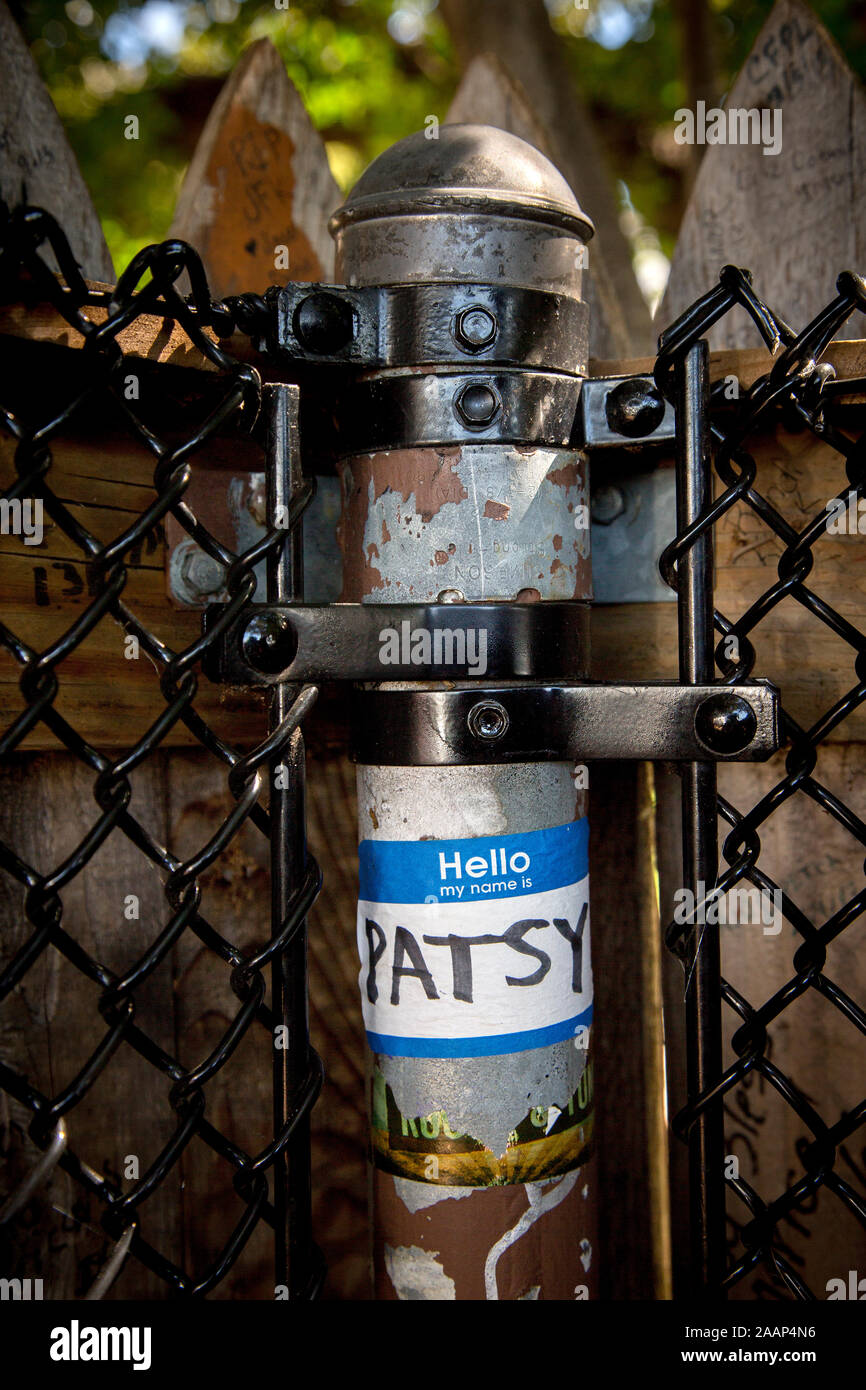 A visitor sticker with the text "Hello, My name is Patsy" on the wooden ...