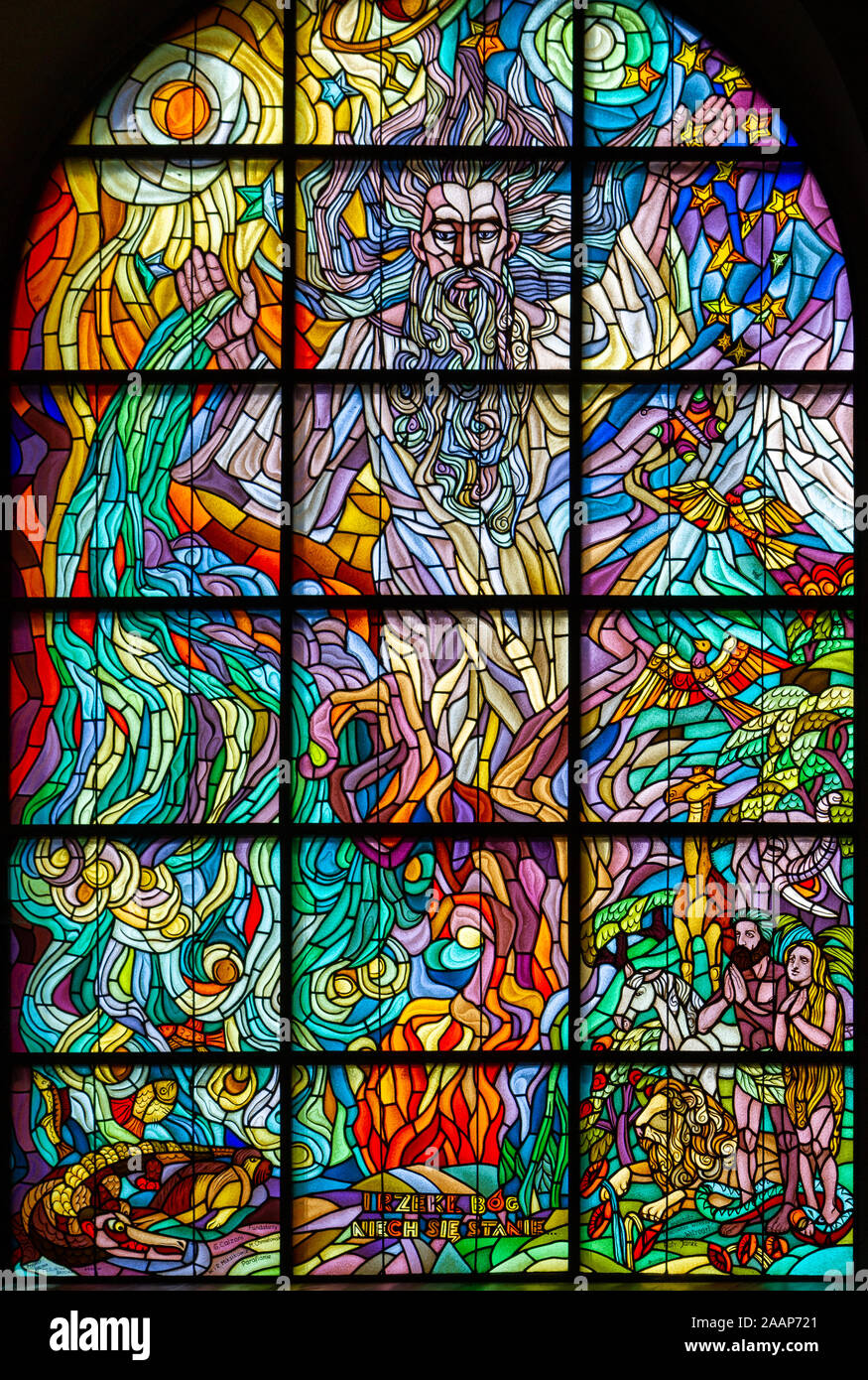 Stained-glass window depicting the Creation of the World with the words ...