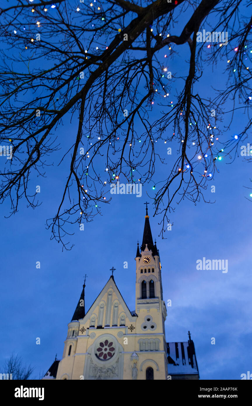 Church and New Year tree. Christmas celebrations. Vertical frame Stock ...