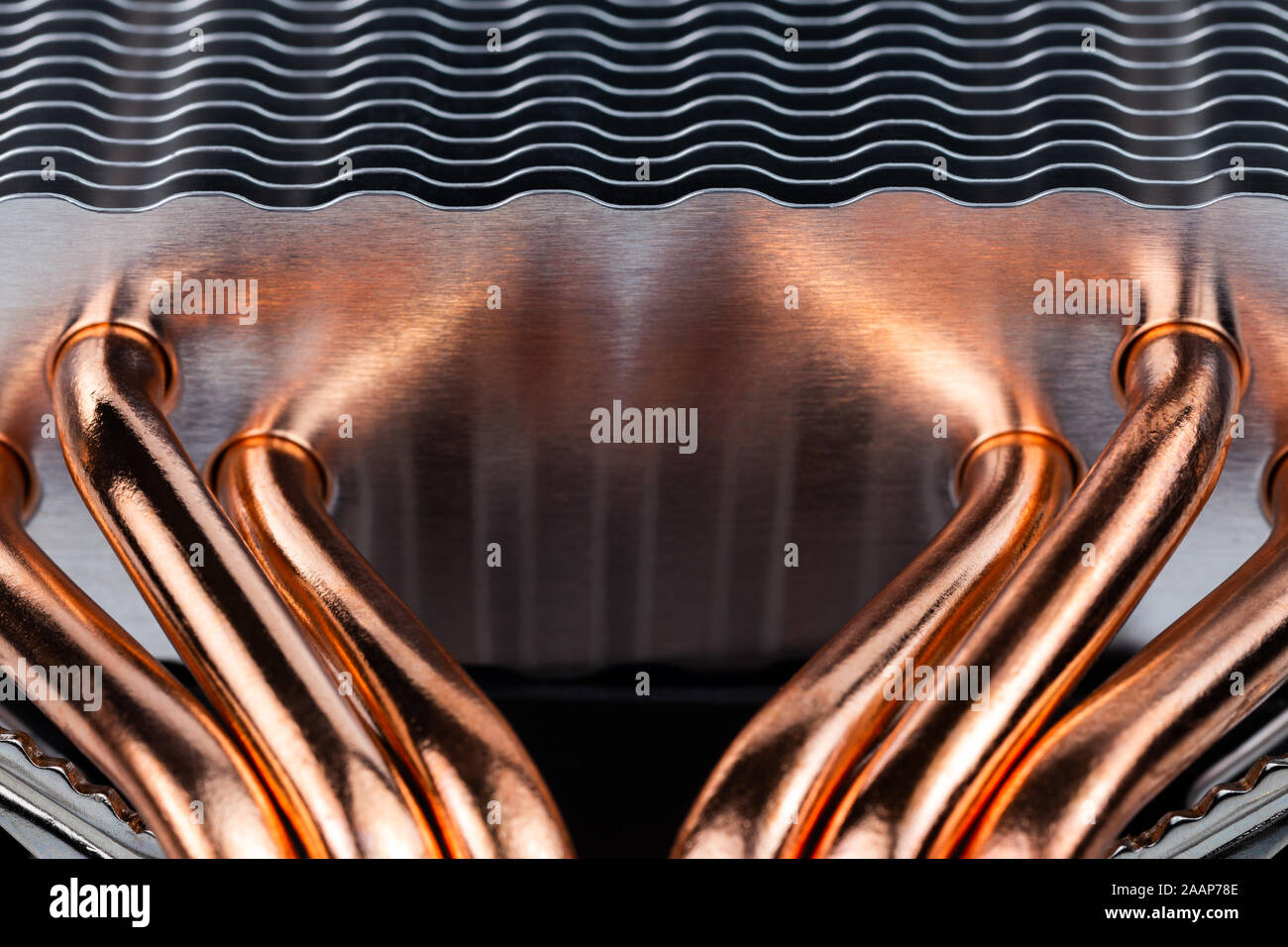 modern tower heat radiator with six copper heatpipes close-up macro ...